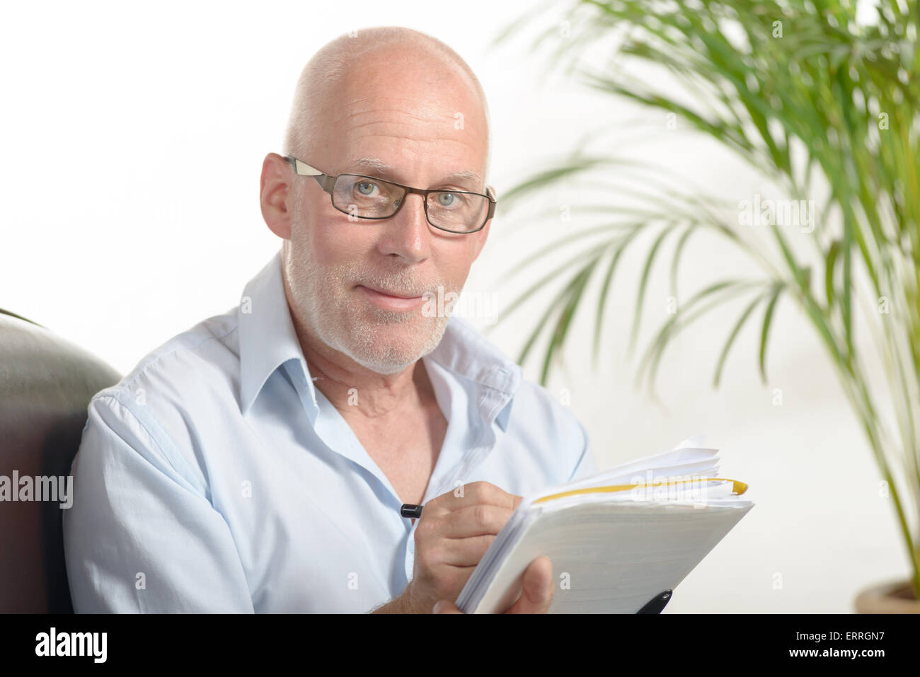 portrait of a middle-aged man with scratch pad Stock Photo - Alamy