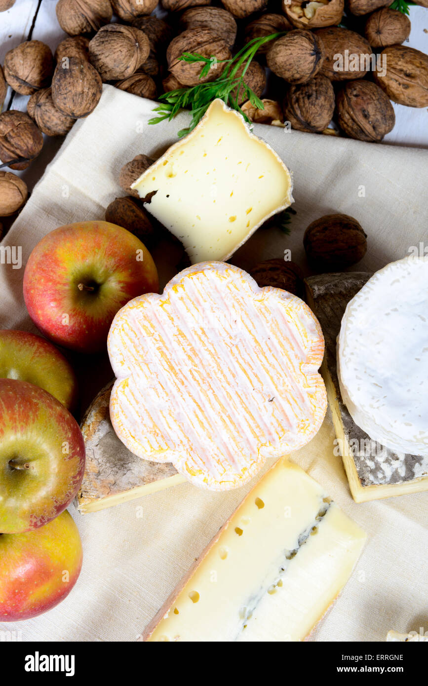 several french cheeses with apples and nuts Stock Photo - Alamy