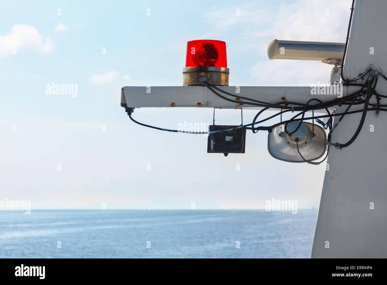 Red beacon light on white mast of ship Stock Photo - Alamy