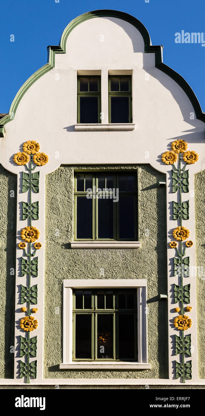 Colourful building facade with painted carved flowers Stock Photo - Alamy