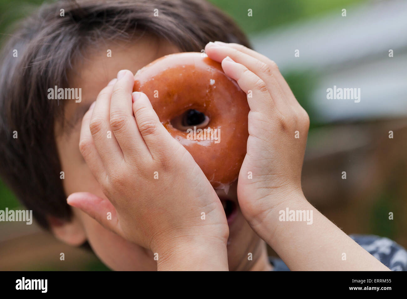 Boy Eating A Donut High Resolution Stock Photography and Images - Alamy