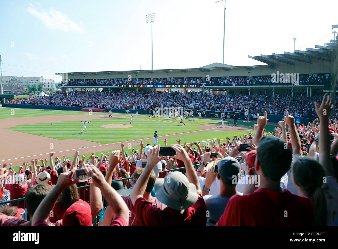 Jun, 2015: Members of the Razorback baseball team storm the field ...