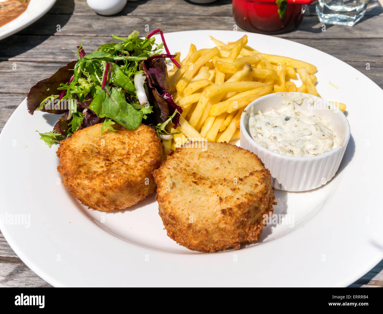 A café lunch of home made fish cakes with salad garnish, French Fried ...