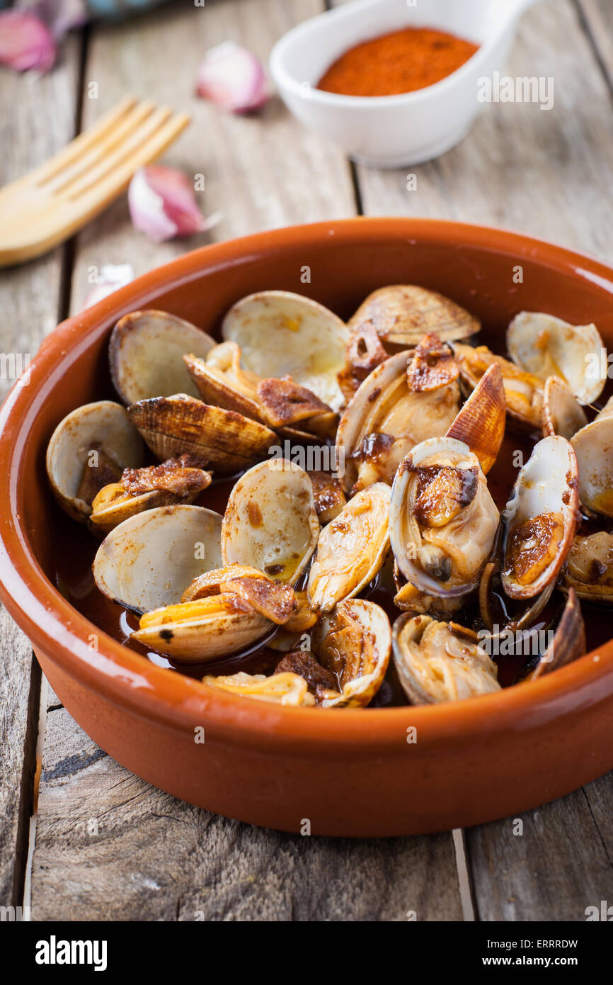 clams with garlic at paprika spanish seafood style Stock Photo - Alamy