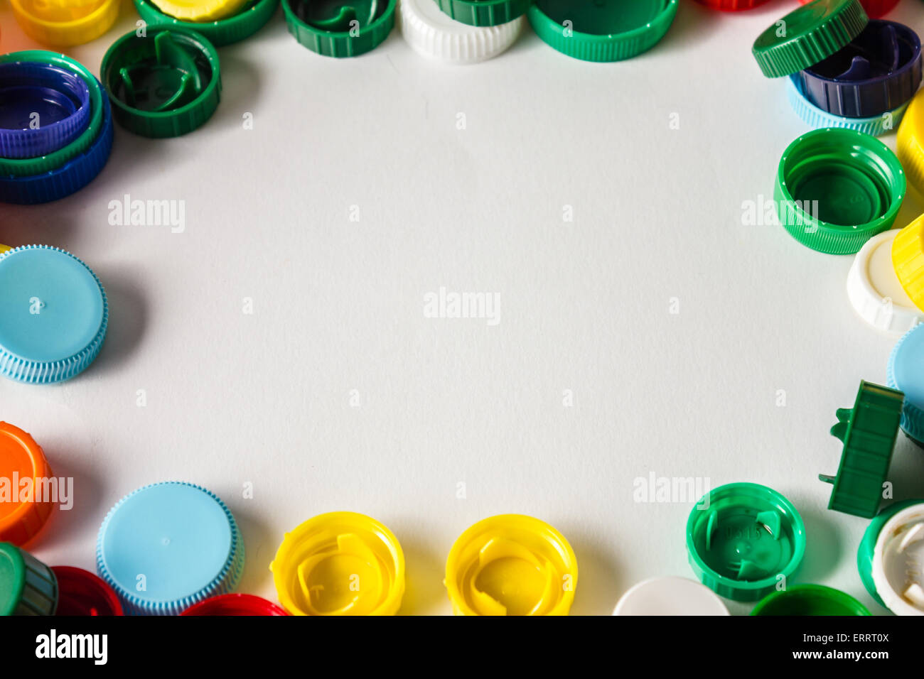 Colorful plastic caps in white background Stock Photo - Alamy