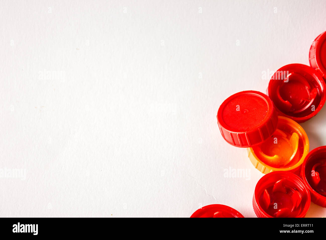 Colorful plastic caps in white background Stock Photo - Alamy