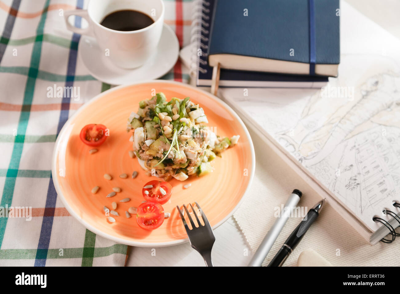Russian salad for breakfast on a checkered cloth and notepads Stock Photo - Alamy