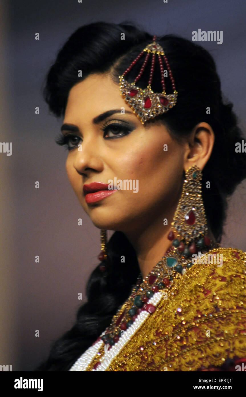 Karachi. 7th June, 2015. A model presents a creation designed by Adnan Pardesi during the last ...