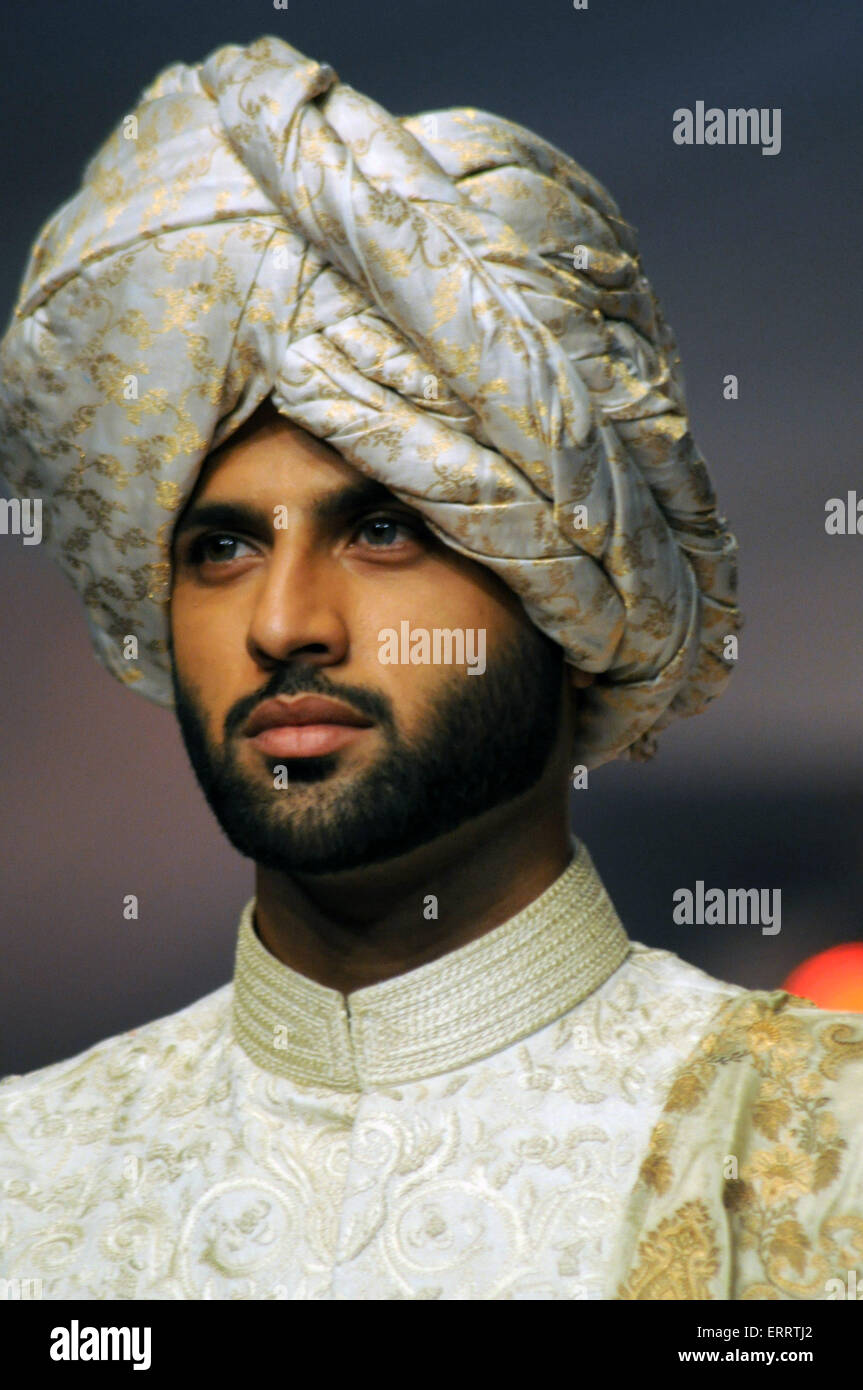 Karachi. 7th June, 2015. A model presents a creation designed by Adnan Pardesi during the last ...