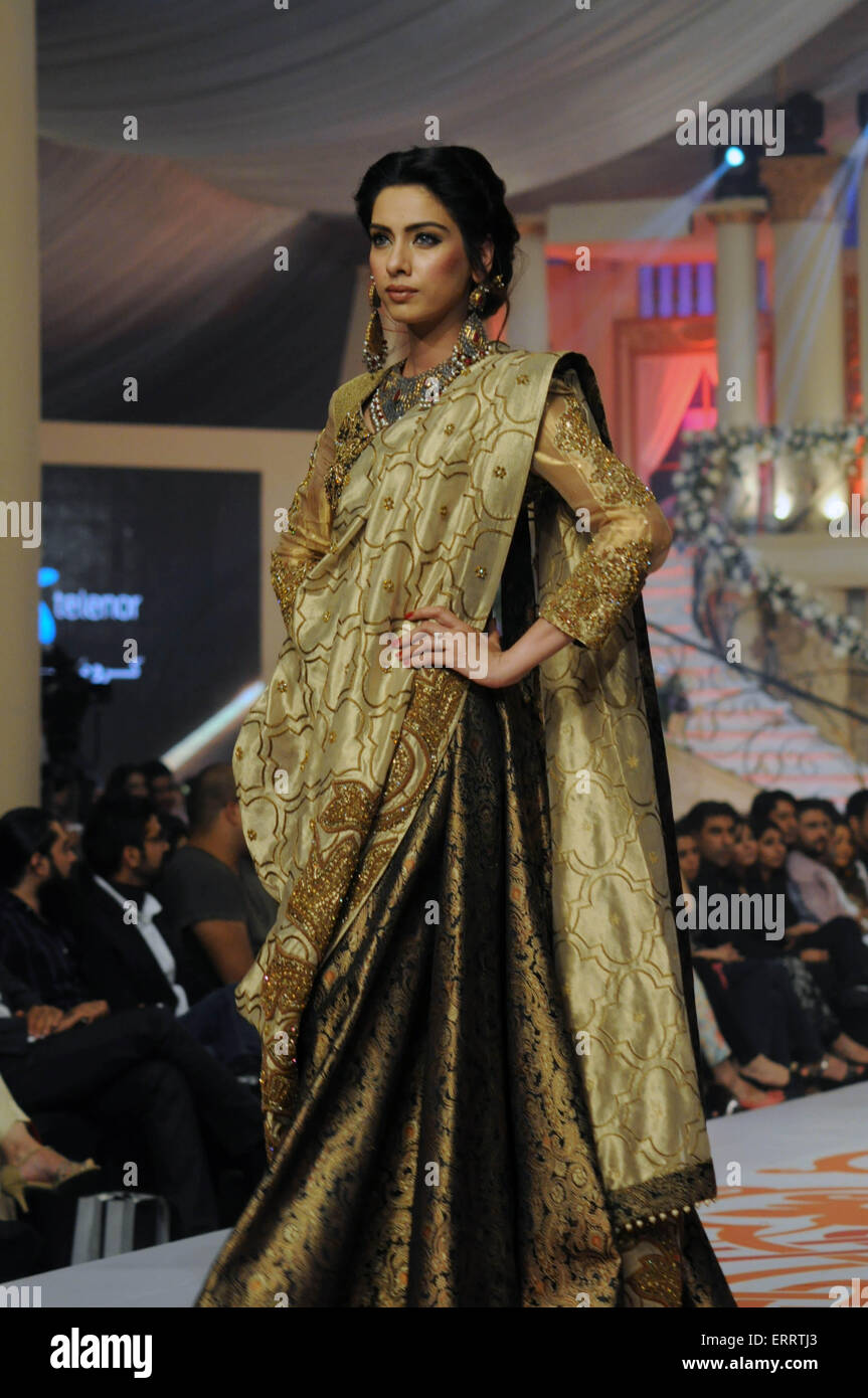 Karachi. 7th June, 2015. A model presents a creation designed by Adnan Pardesi during the last ...