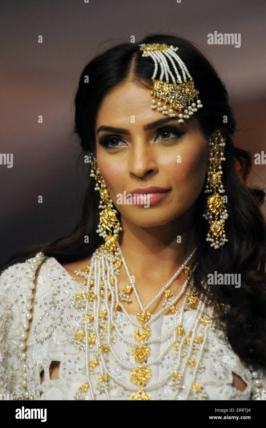 Karachi. 7th June, 2015. A model presents a creation designed by Adnan Pardesi during the last ...