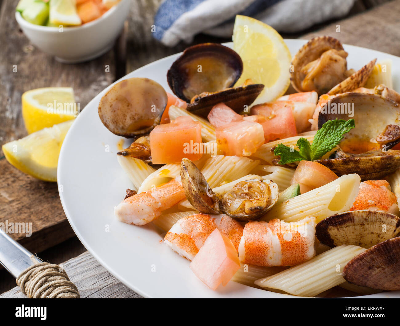 macaroni with prawn and clams at seafood style on white plate Stock ...