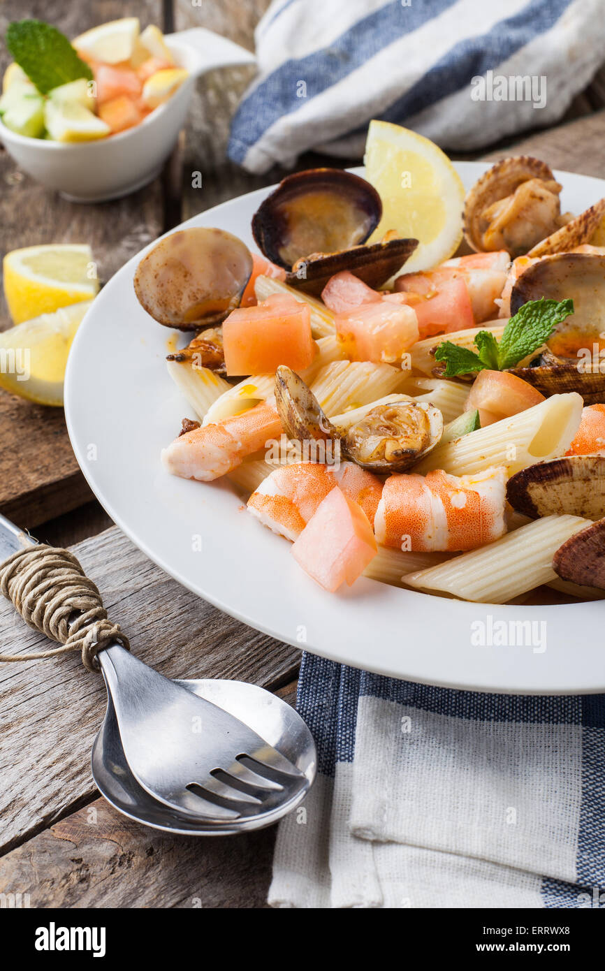 macaroni with prawn and clams at seafood style on white plate Stock ...