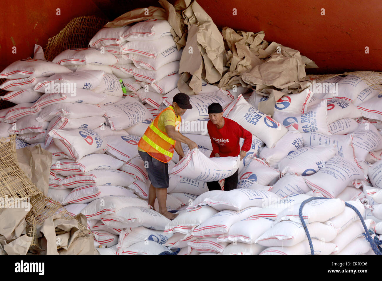 Navotas City, Philippines. 8th June, 2015. Workers unload sacks of ...