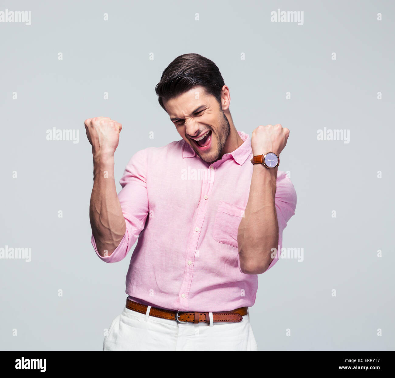 Happy young man celebrating hi-res stock photography and images - Alamy