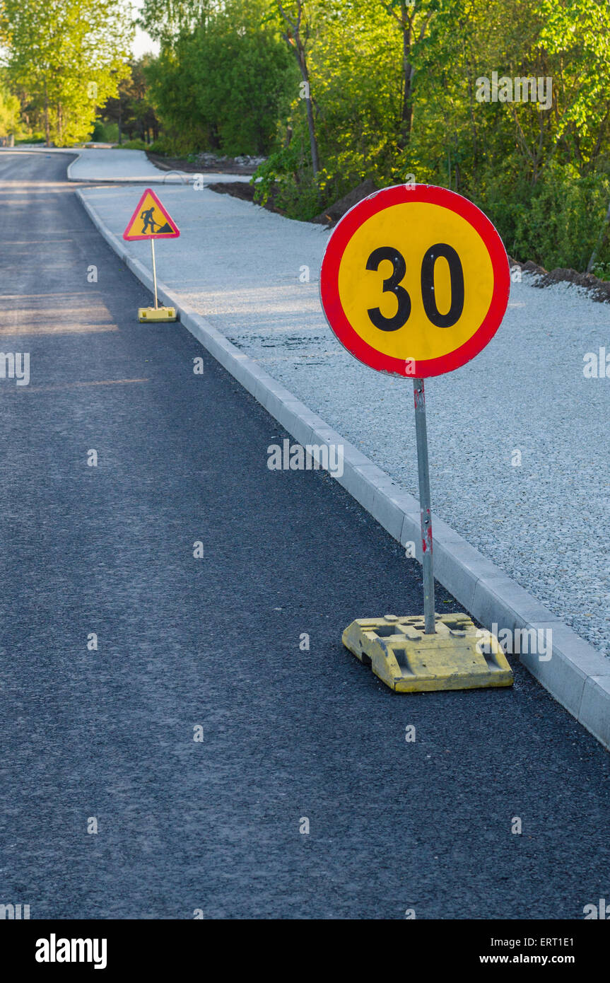 New road construction warning ans speed limitation signs Stock Photo ...