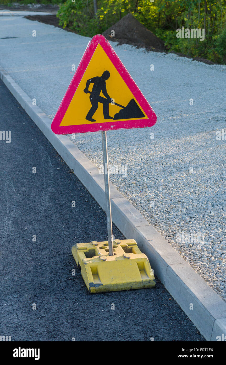 Warning sign of road renovation Stock Photo - Alamy