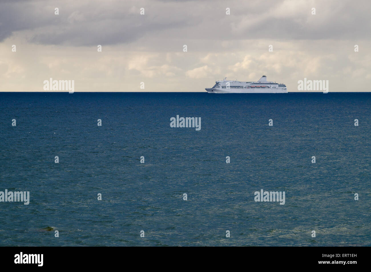 Cruise ship afar at blue water Stock Photo - Alamy