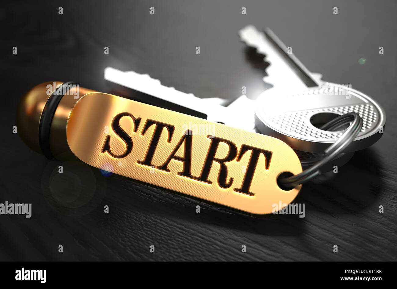 Start written on Golden Keyring Stock Photo - Alamy