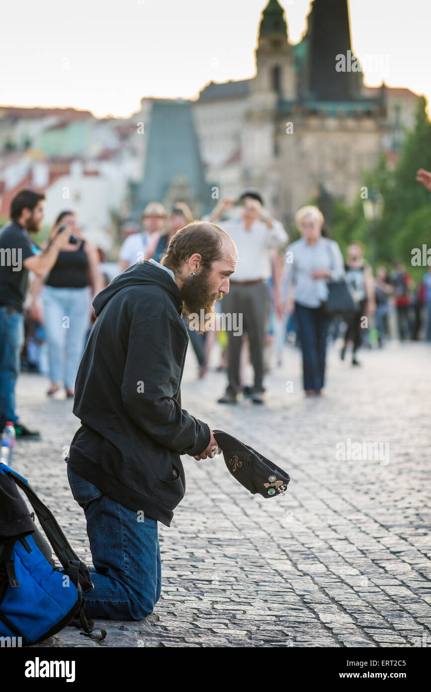 Beggar on Charles Bridge in Prague, Europe Stock Photo - Alamy