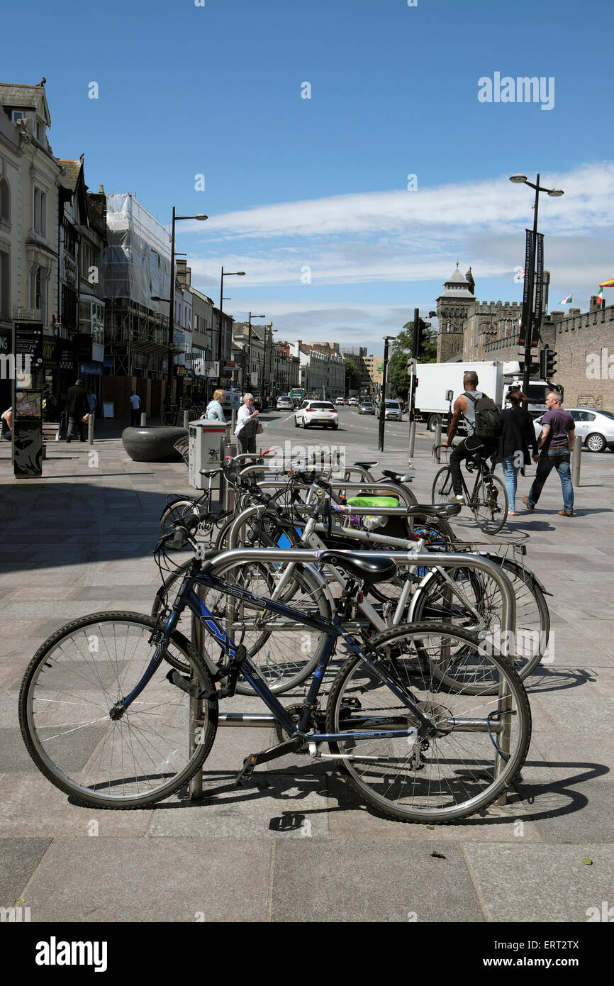 Bikes parked in Cardiff City Centre pedestrian area with a view of the ...