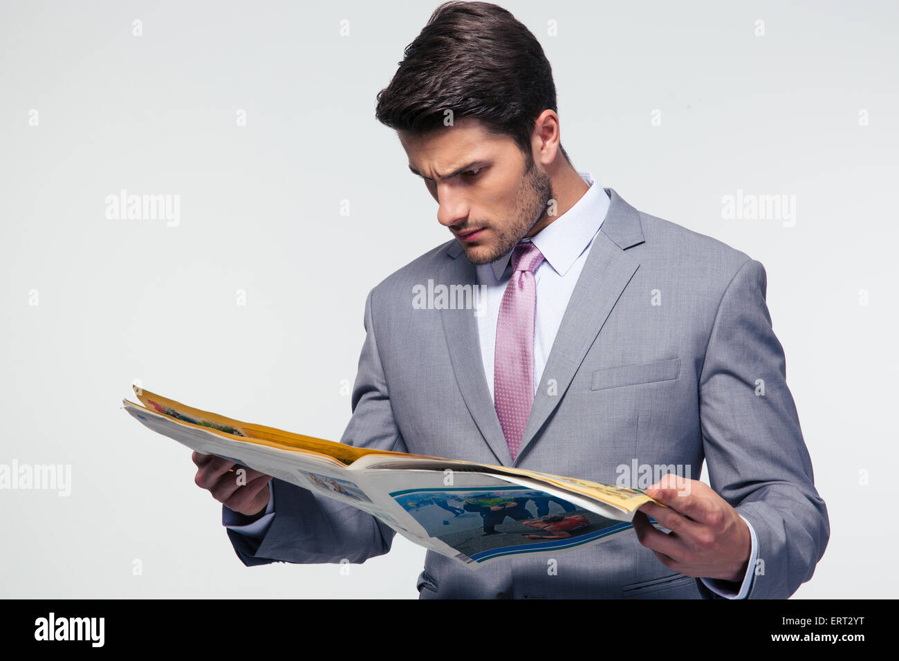 Successful businessman reading magazine hi-res stock photography and ...
