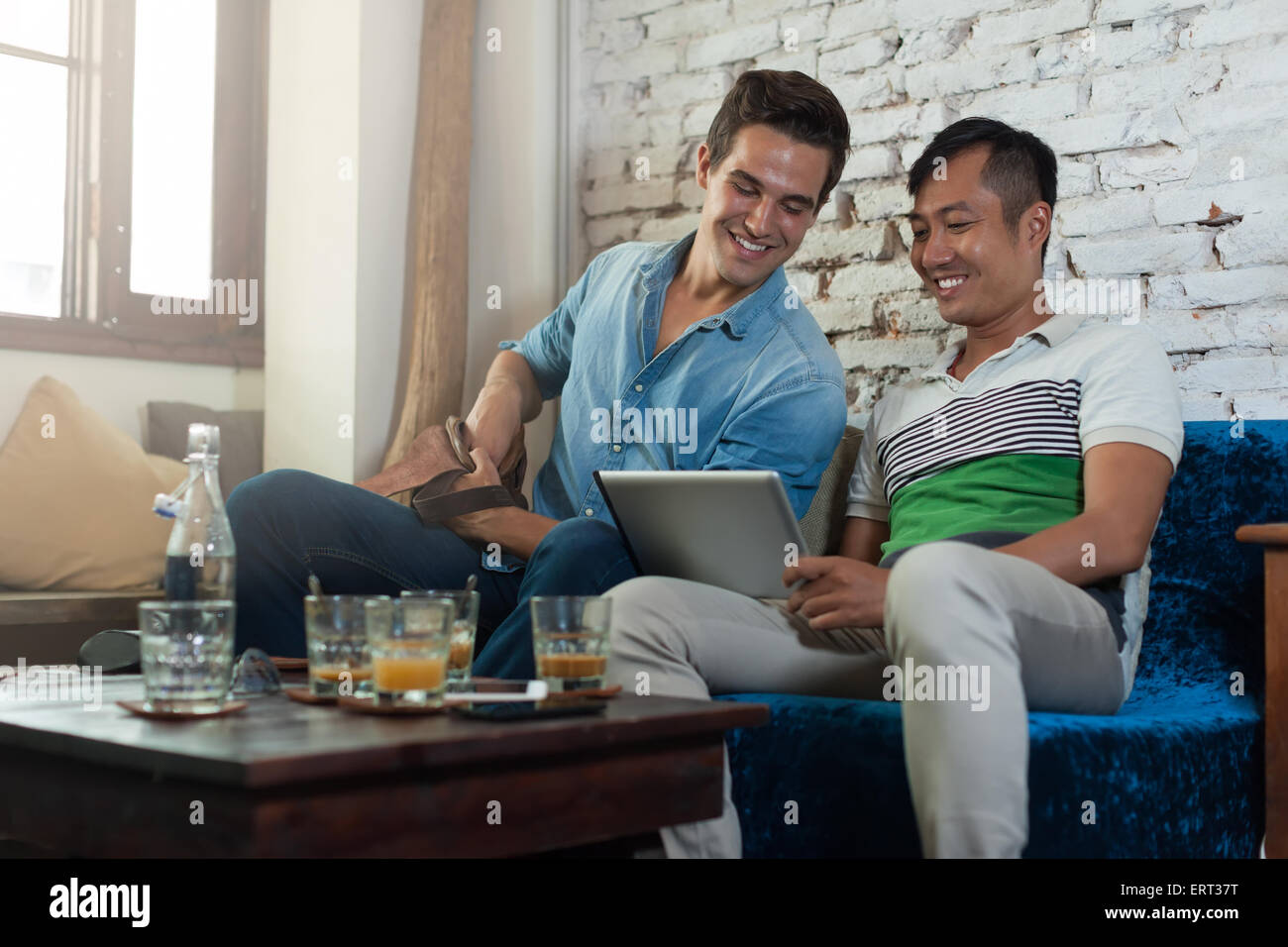 Two Men Using Tablet Computer at Cafe, Friends Guys Sitting Coffee Shop ...