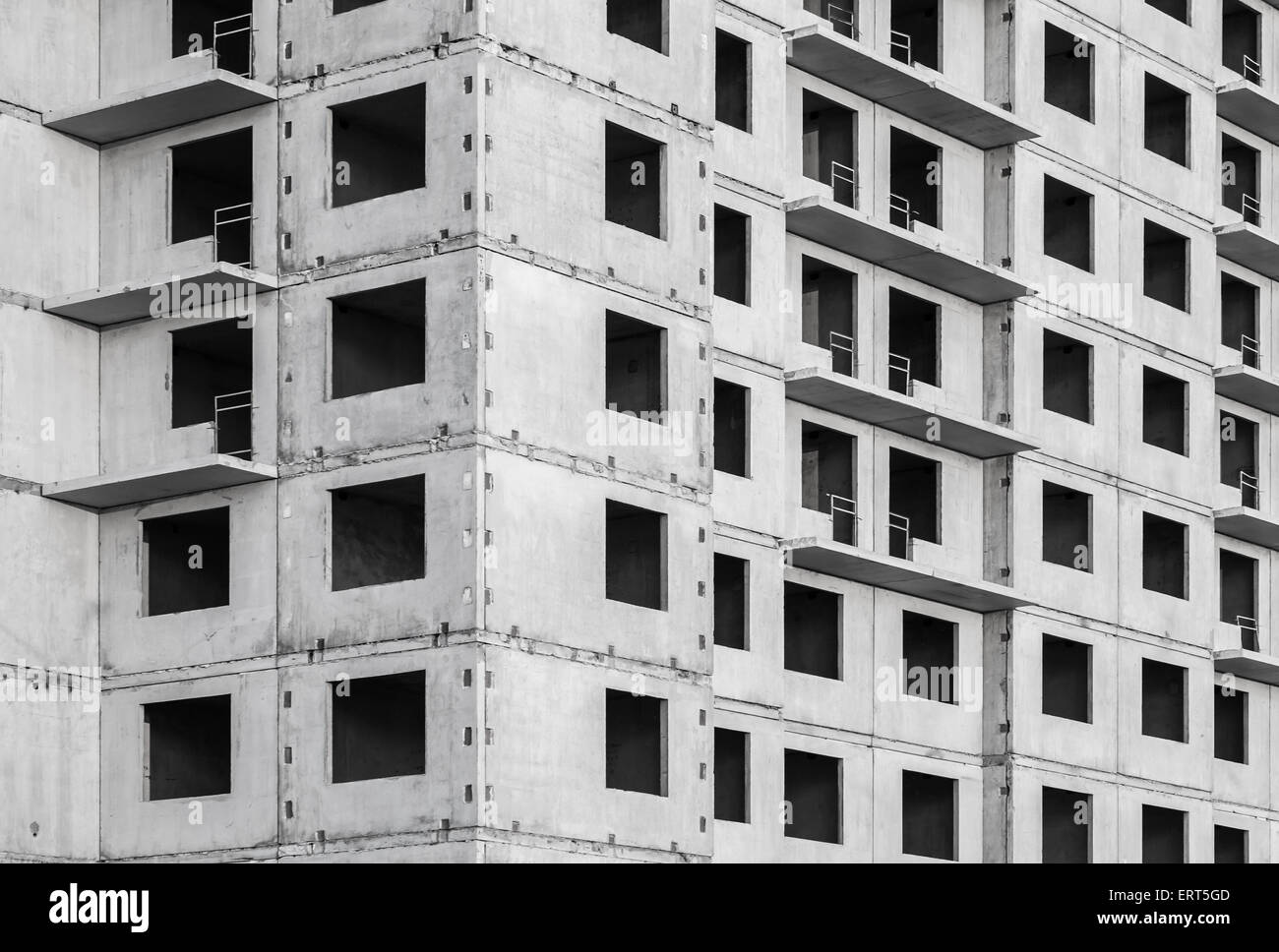 Typical living house facade made of gray concrete blocks is under ...