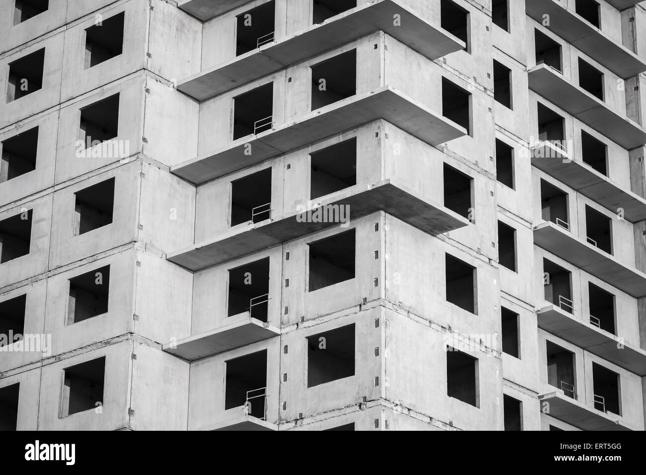 New typical living house facade made of gray concrete blocks is under ...