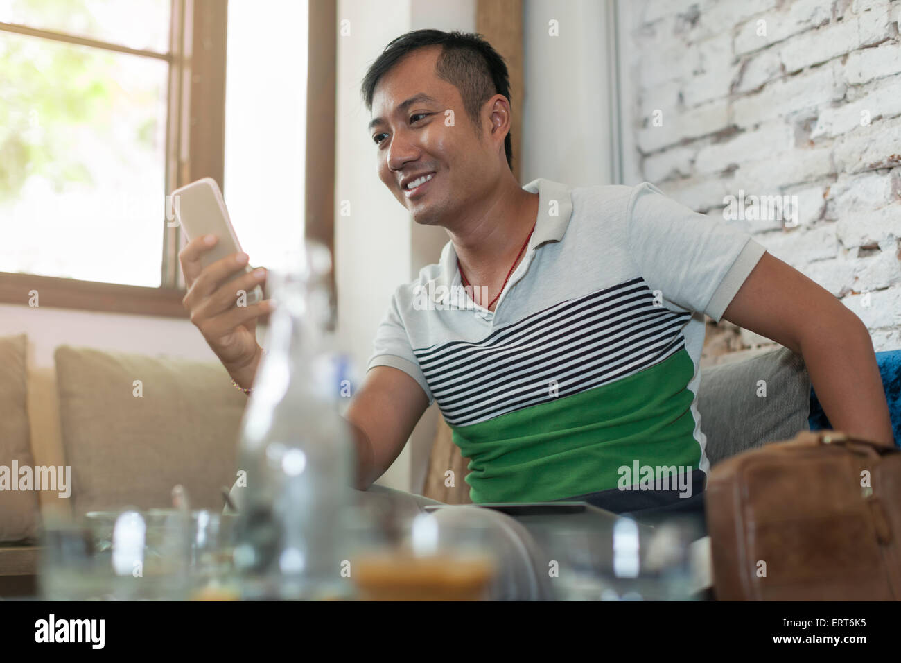 Asian Man Using Cell Phone Smile Sitting Cafe Stock Photo - Alamy