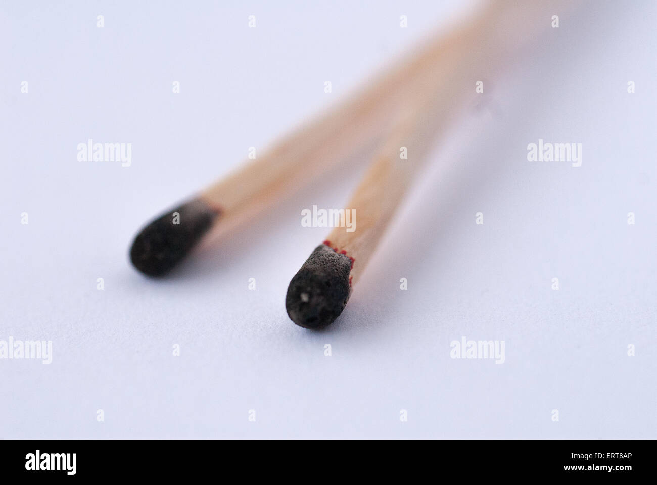 Two burnt matchsticks Stock Photo - Alamy