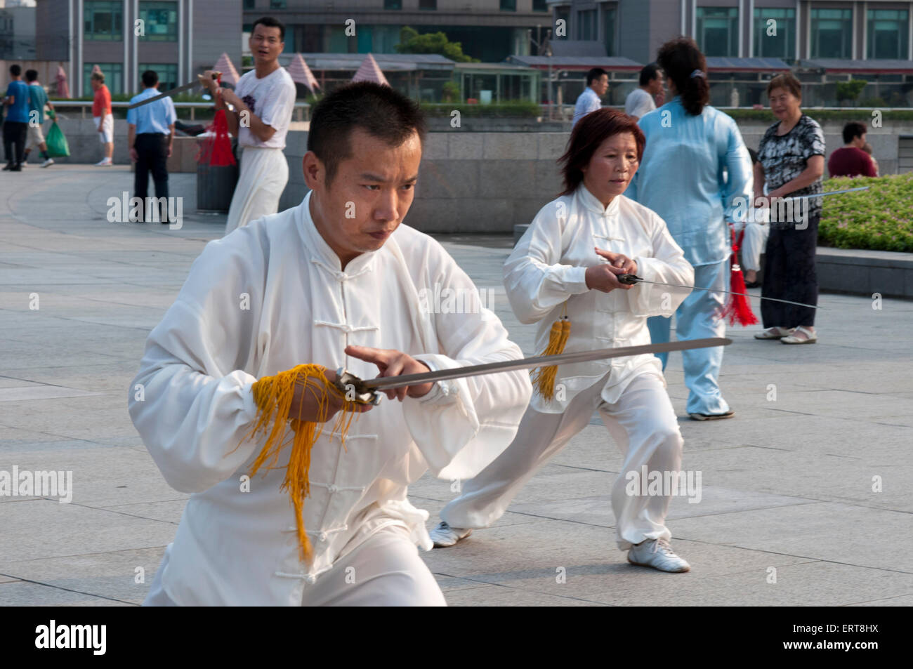 China, Shanghai, morning tai chi exercise on The Bund. Shanghi Bund ...