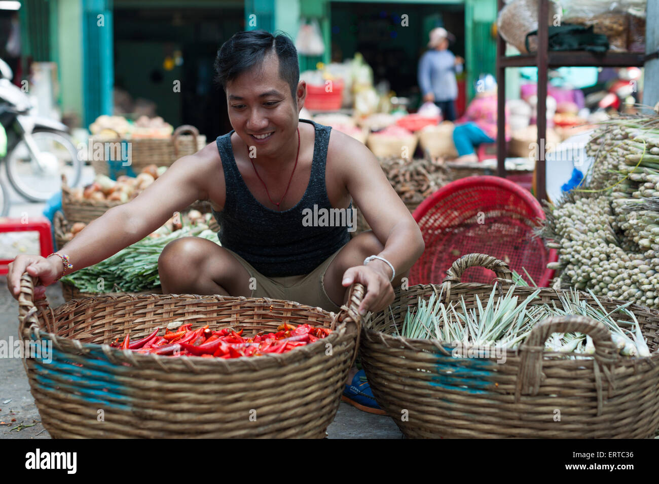 Asian man street market sell basket red chilly pepper Stock Photo - Alamy