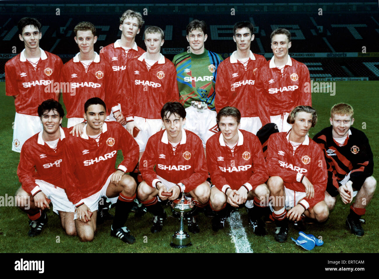 Manchester United youth team pose with the Lancashire Youth Cup ...