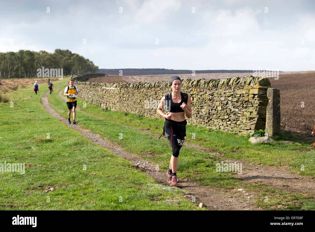 Men and women long distance runners in the Peak District Derbyshire ...
