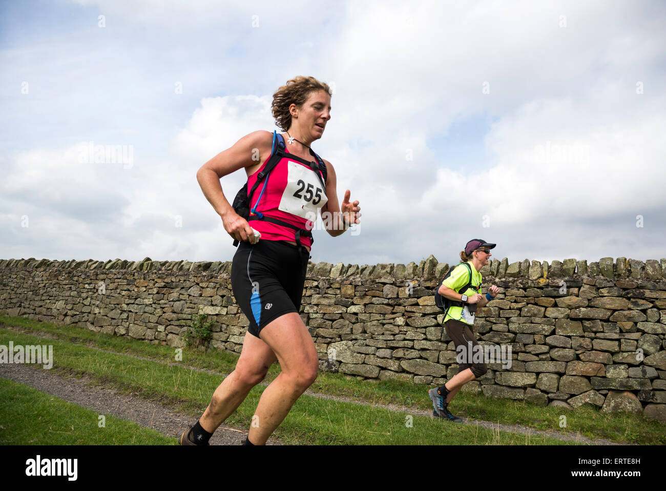 Men and women long distance runners in the Peak District Derbyshire ...