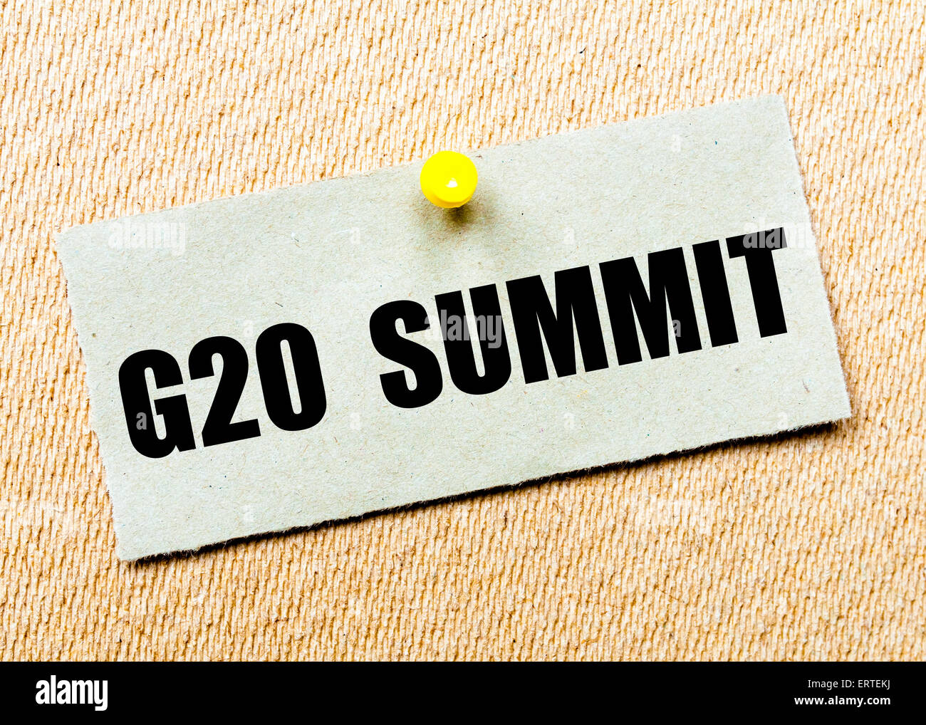 Recycled paper note pinned on cork board with words G20 SUMMIT. Concept ...