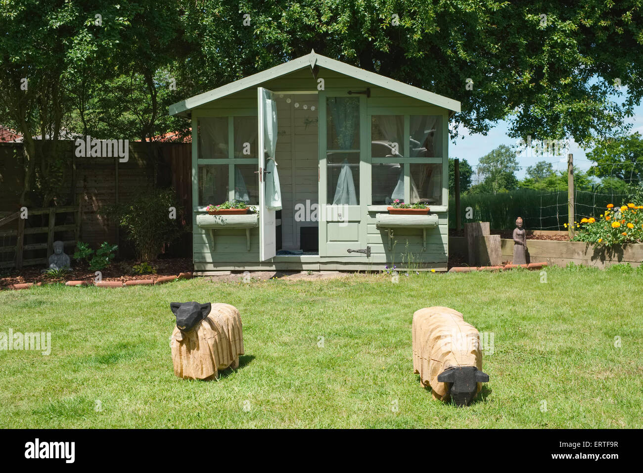 Summer House in Garden with Two Carved Wooden Sheep on Lawn Stock Photo ...