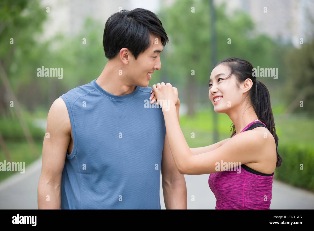 Young couple taking a break from exercise to talk Stock Photo - Alamy
