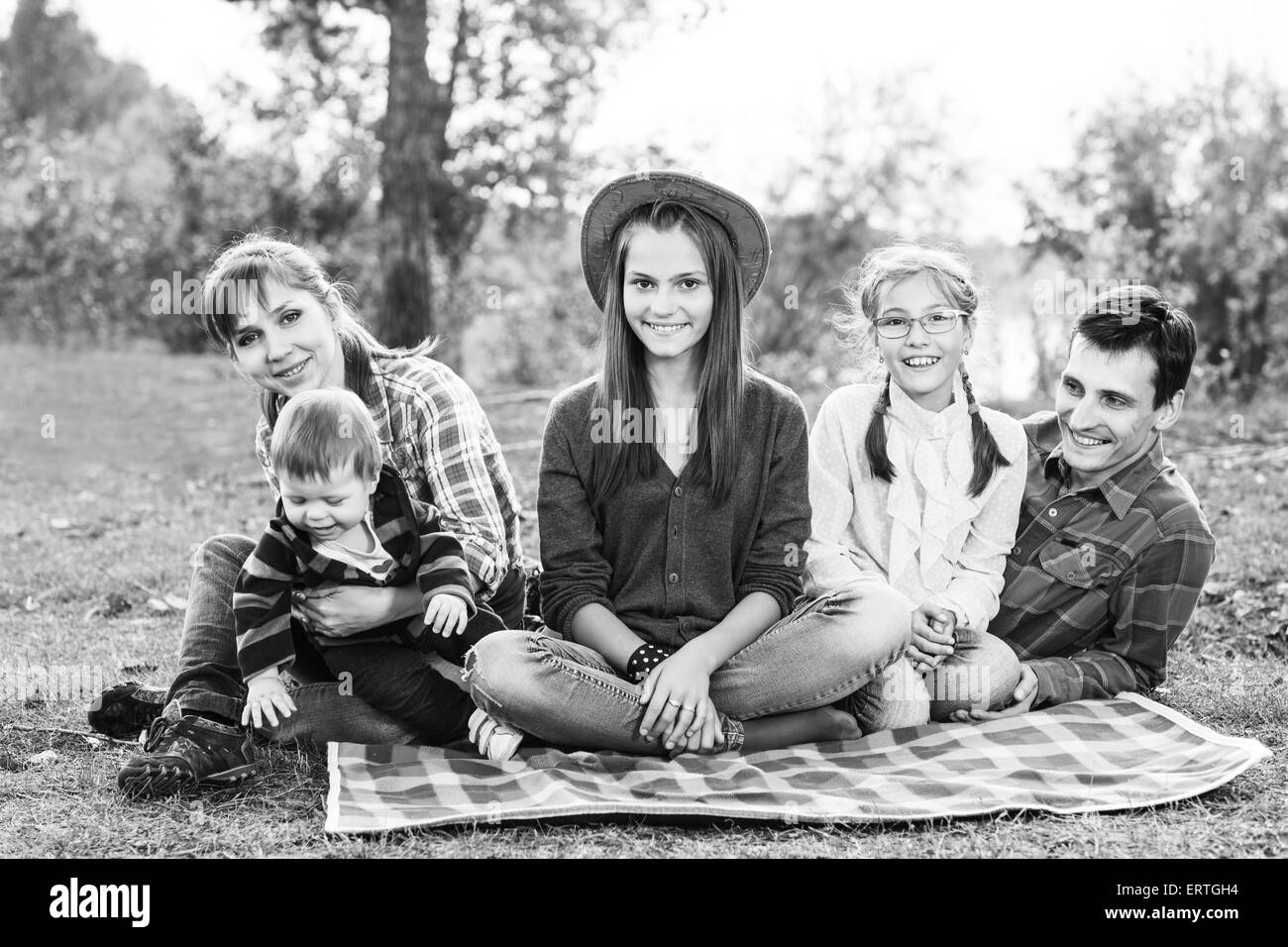 Happy family outdoors Stock Photo - Alamy