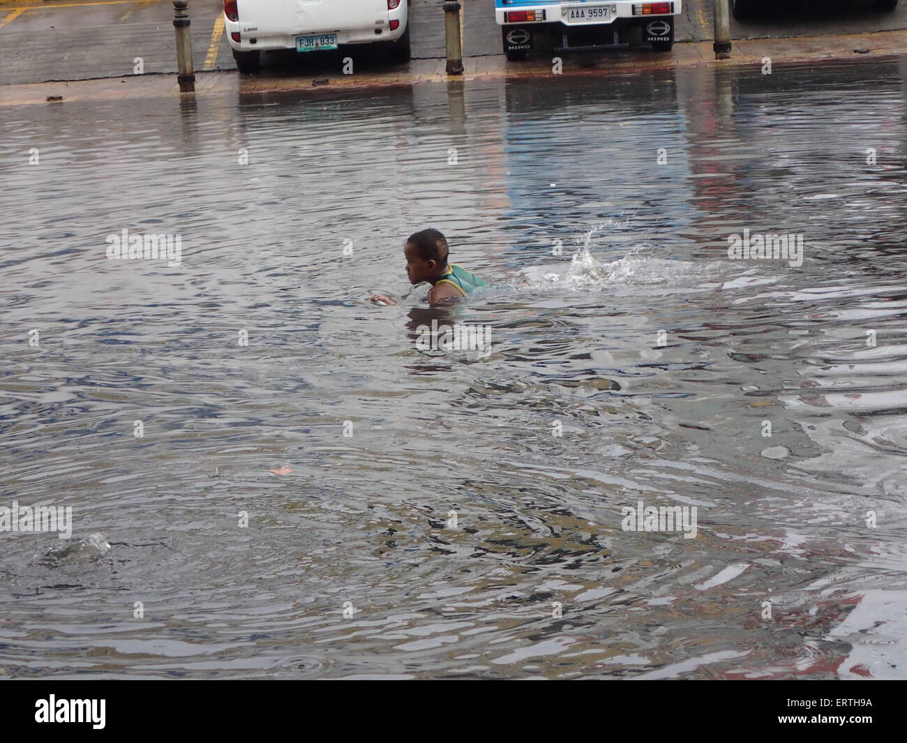 Quezon City, Philippines. 08th June, 2015. A kid swimming along the ...