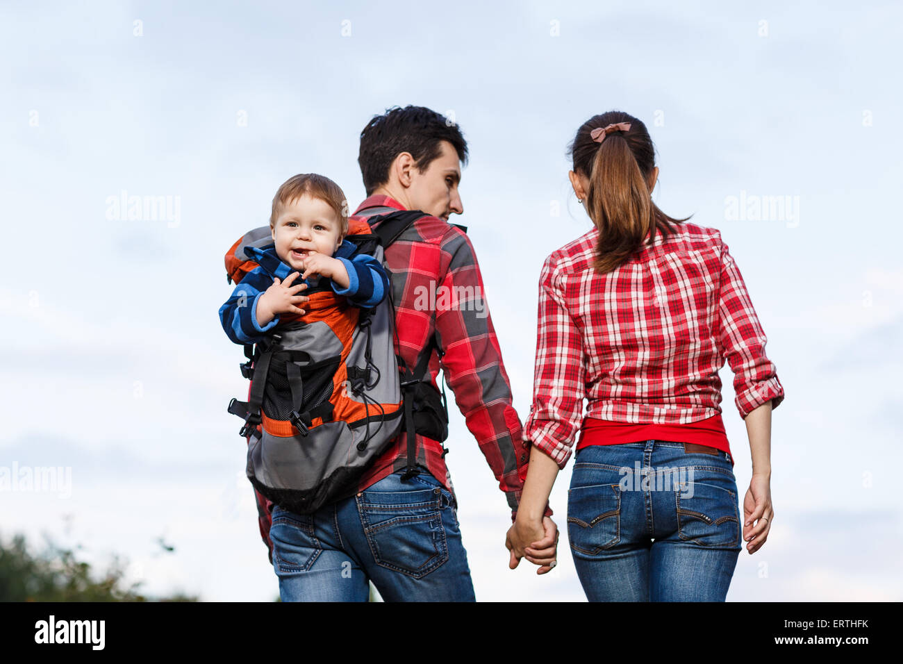Baby boy in backpack Stock Photo - Alamy