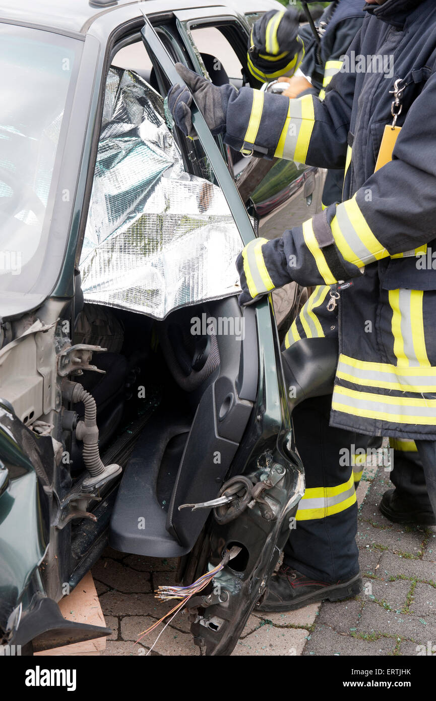 Rescue operation of the fire brigade on a car Germany Stock Photo - Alamy