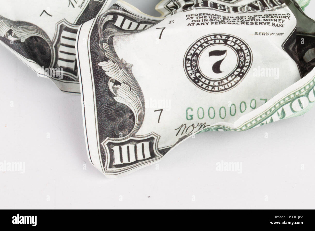 Close up detailed top view of crumpled one hundred dollar bannotes ...