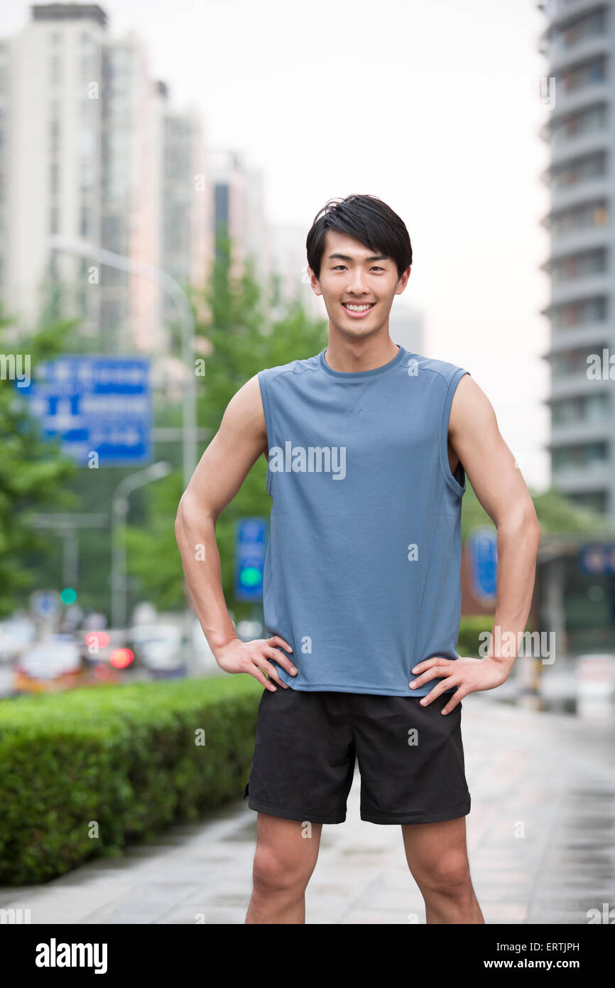 Young man doing exercise outside Stock Photo - Alamy