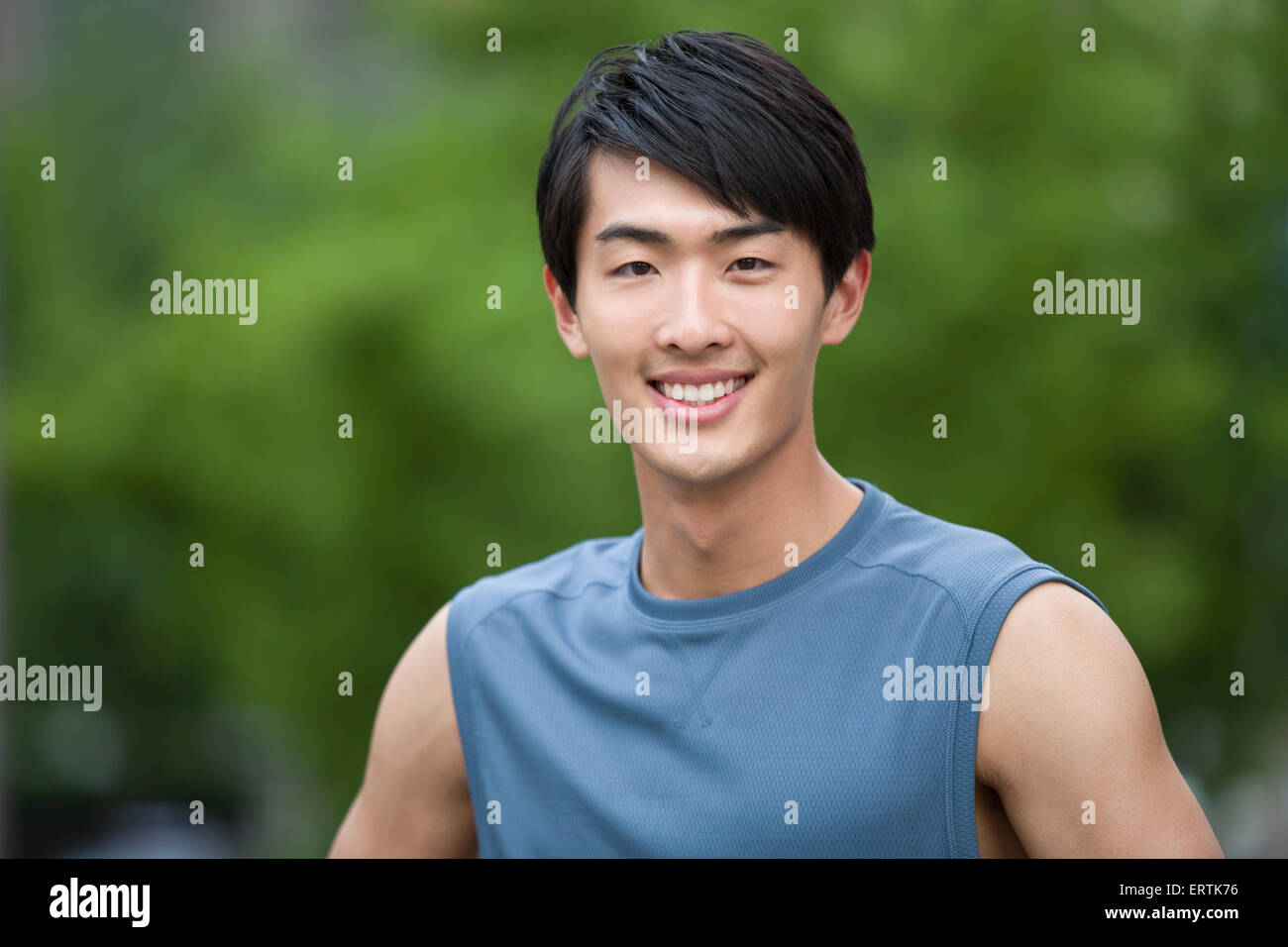 Young man doing exercise outside Stock Photo - Alamy
