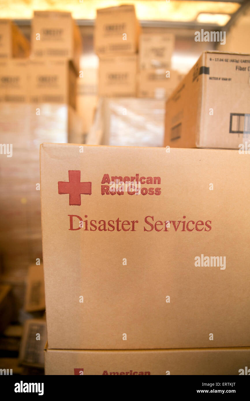 cardboard boxes with disaster supplies donated by the American Red ...