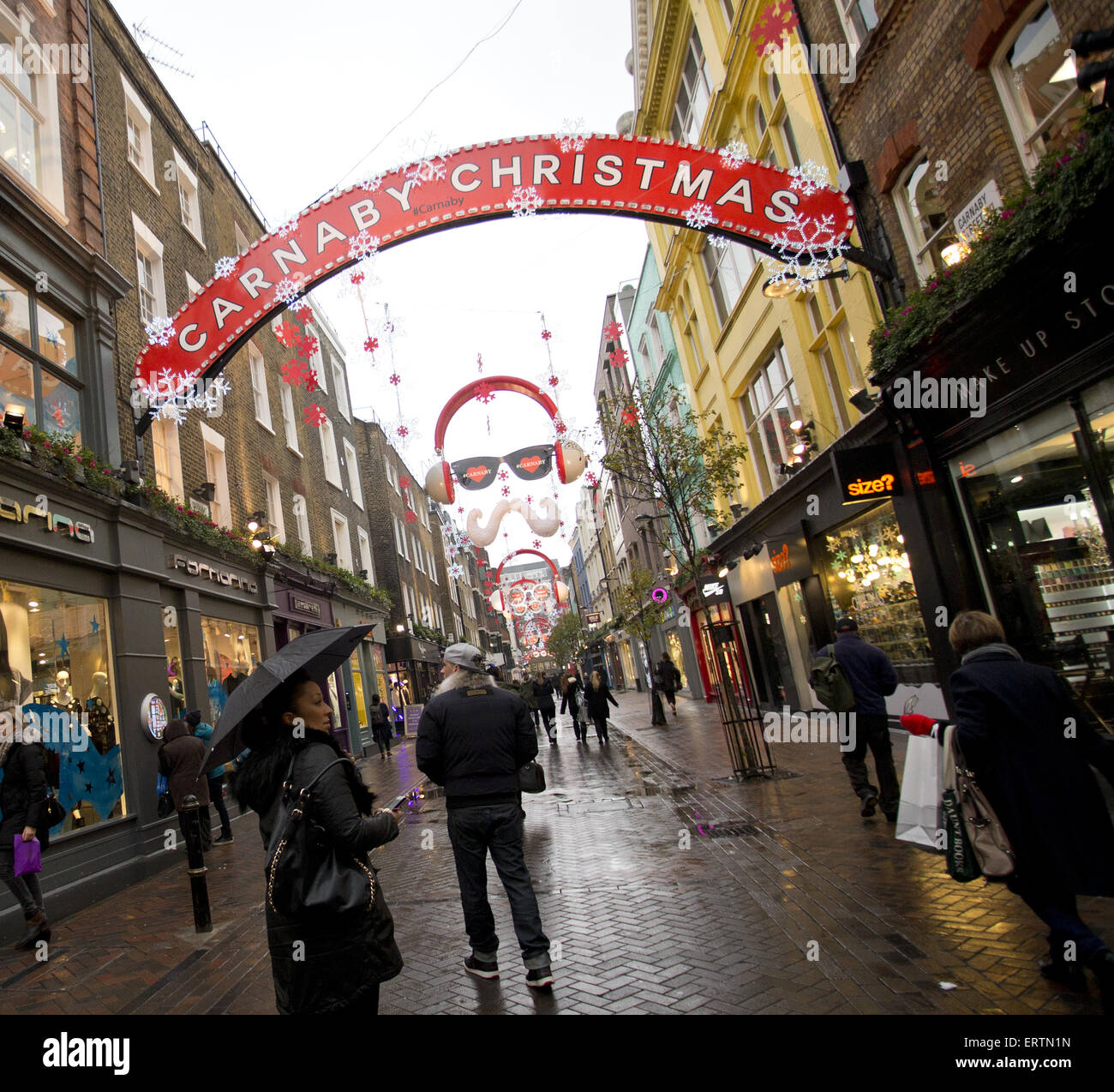 Shoppers brave the dismal weather to visit the shops in London's West ...