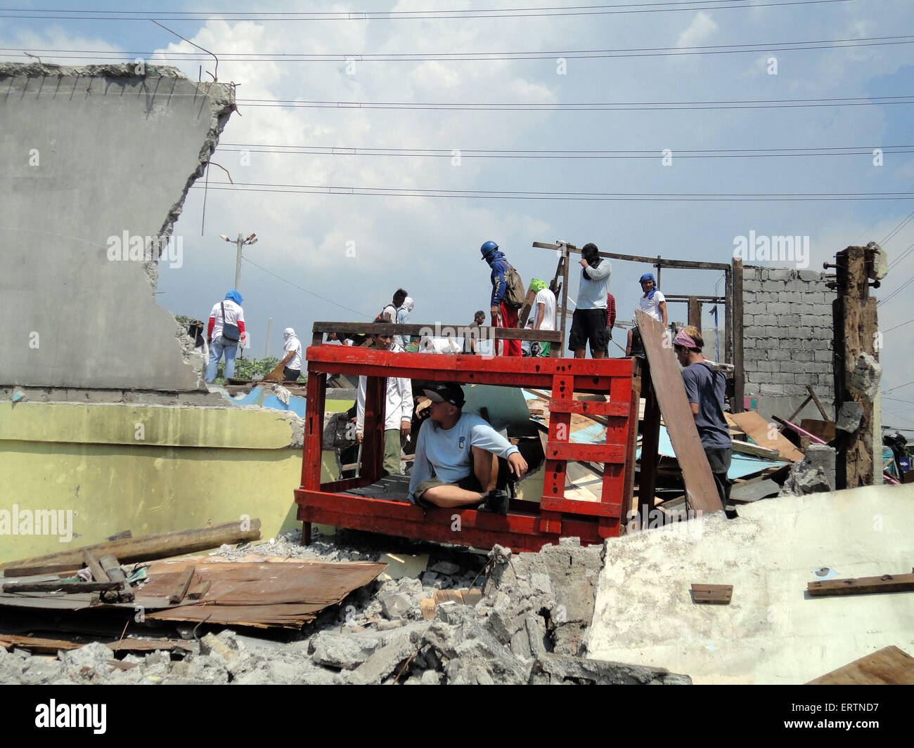 Navotas City, Philippines. 08th June, 2015. A member of the demolition ...