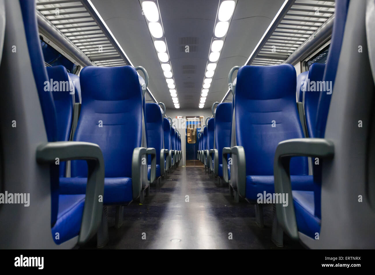 Perspective view of seats from the aisle inside a passenger train Stock ...